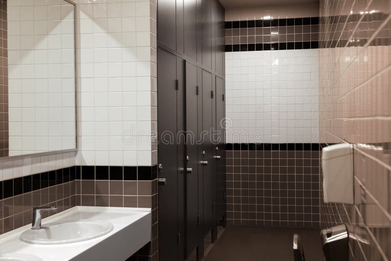Public Toilet Interior with Sinks, Stalls and Mirror Stock Image ...