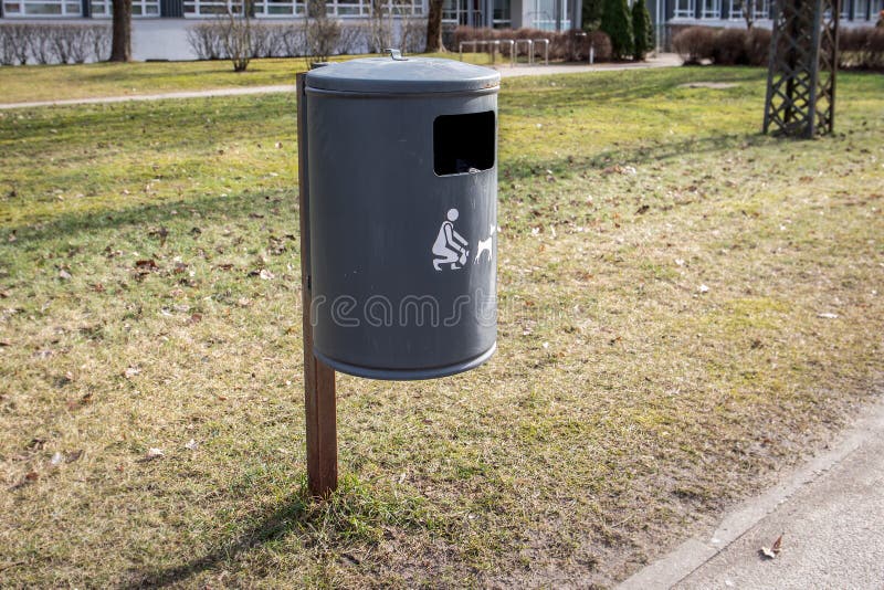 Public Trash Bin for Dog Waste with Icon in Park Stock Photo - Image of ...