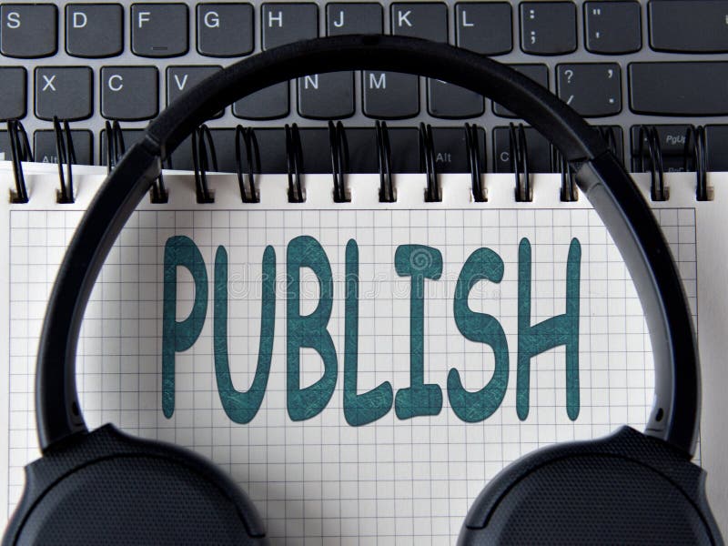 PUBLISH -word on White Notepad with Keyboard and Headphone Background ...