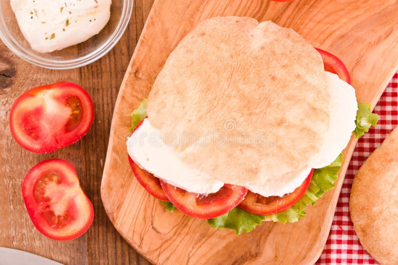 Puccia Bread with Mozzarella and Tomato. Stock Photo - Image of arugula ...