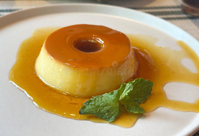 Pudding with Sauce Served on a White Plate Stock Image - Image of burnt ...