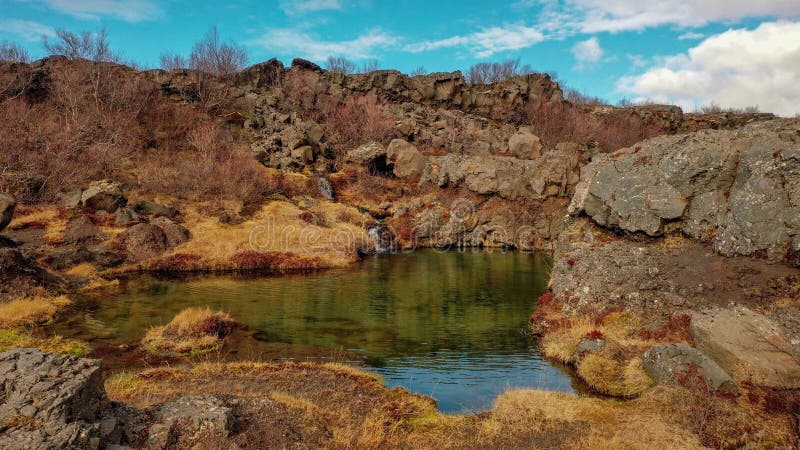 Puddle at the Cascade Waterfall Barnafossar. Stock Photo - Image of ...
