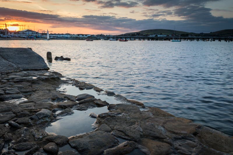 Puddle on Coast Path at Sunset Stock Photo - Image of england, dorset ...