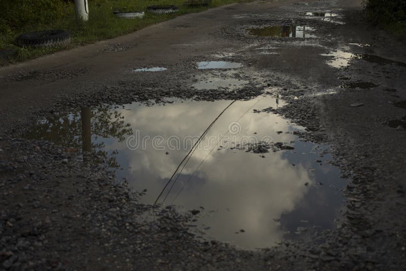 Big Puddle in Road. Reflection of Sky in Puddle Stock Photo - Image of ...
