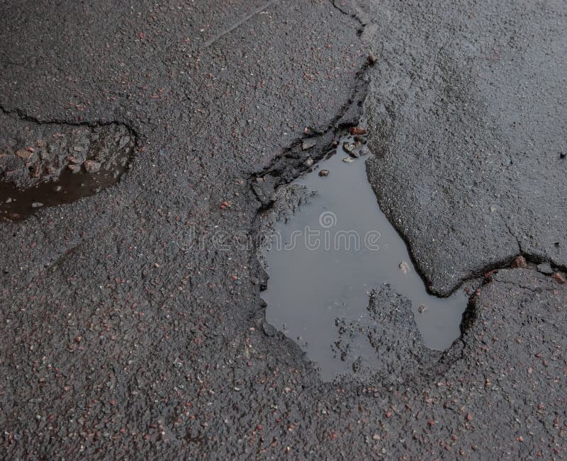 Puddle in a Hole in an Asphalt Road Stock Image - Image of deserted ...