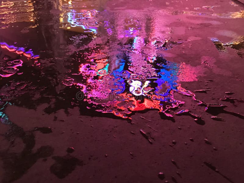 Puddle with lights stock photo. Image of blue, colorful - 112308942
