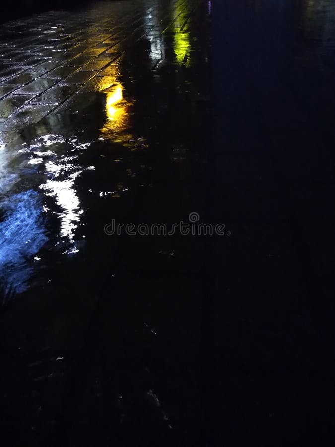 Puddle at Night on a Tiled Road in the City Stock Image - Image of ...