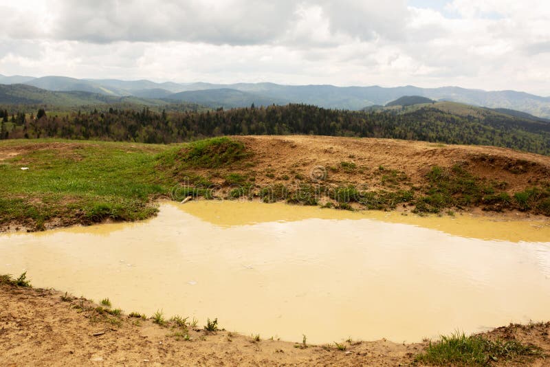 Puddle after Rain in Clay Soil in the Mountains Stock Image - Image of ...
