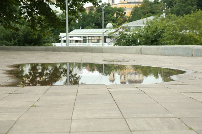 Puddle of Rain Water on Paved Pathway Outdoors Stock Photo - Image of ...