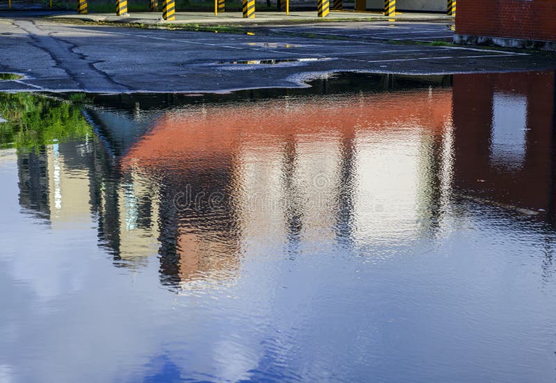 Puddle reflection of house stock photo. Image of house - 89230358