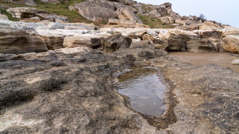 Puddle on the rock stock photo. Image of spain, female - 9157334