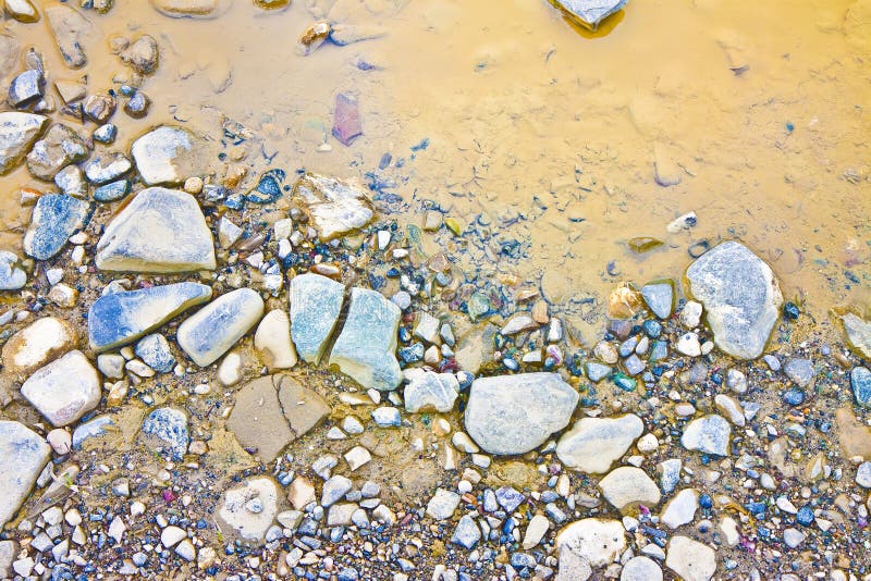Puddle on Rocky Ground with Water and Stones Stock Photo - Image of ...