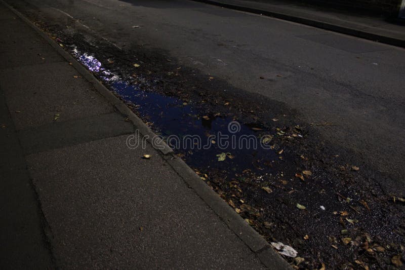 Puddle at Side of Road, Taken at Night Stock Photo - Image of blue ...