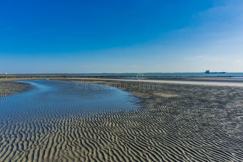 Sandy beach puddle stock image. Image of freshness, beach - 144061823
