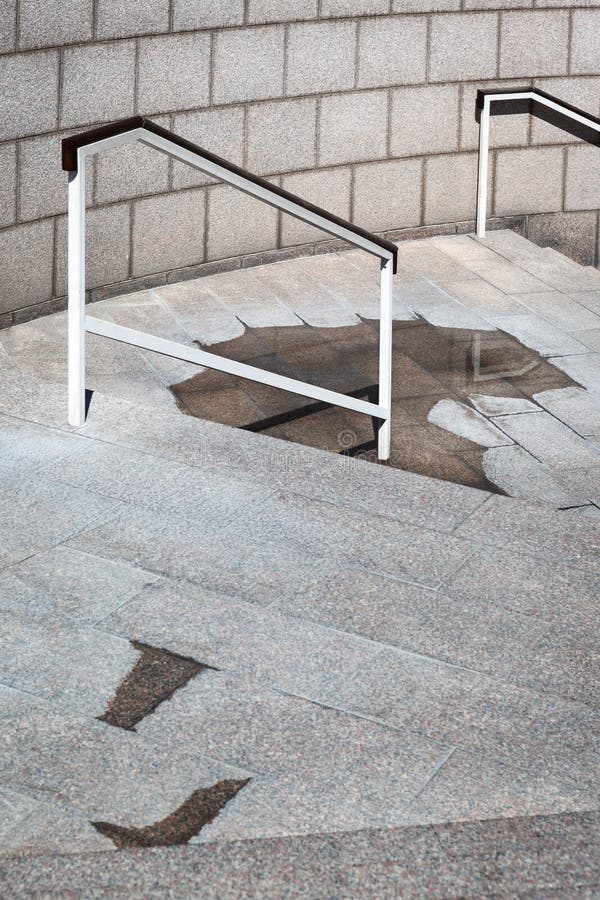 Puddle on the stairs stock image. Image of color, bannister - 80339657