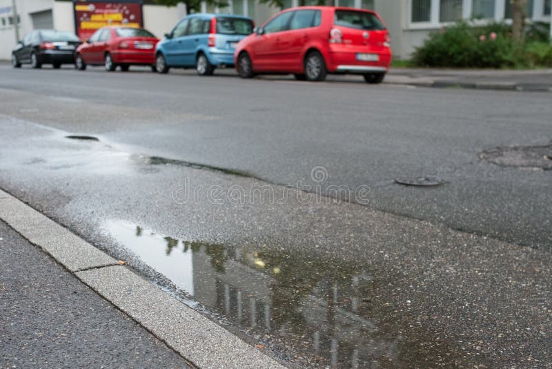 Puddle on a Sidewalk with Leaves in Water Stock Image - Image of park ...
