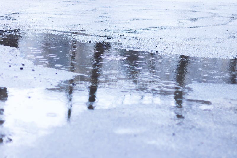 A Puddle on the Street is Raining Stock Photo - Image of drip, pavement ...
