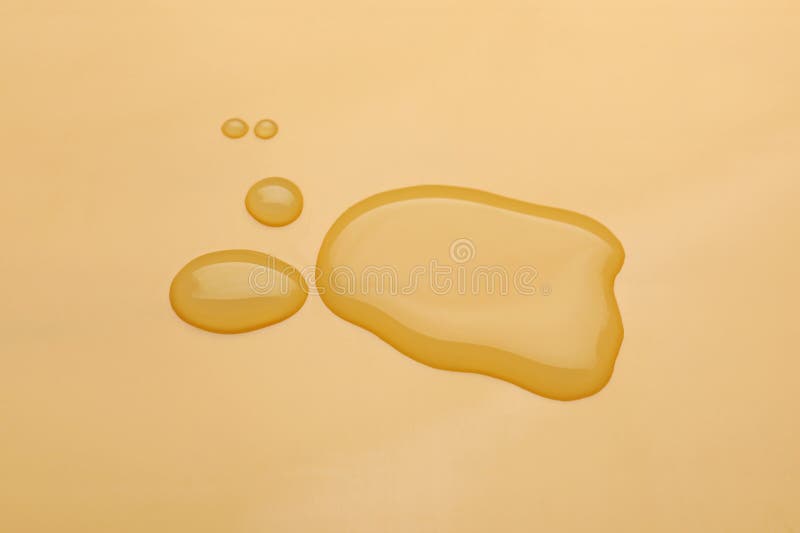 Puddle of Water on Pale Orange Background Stock Image - Image of ...