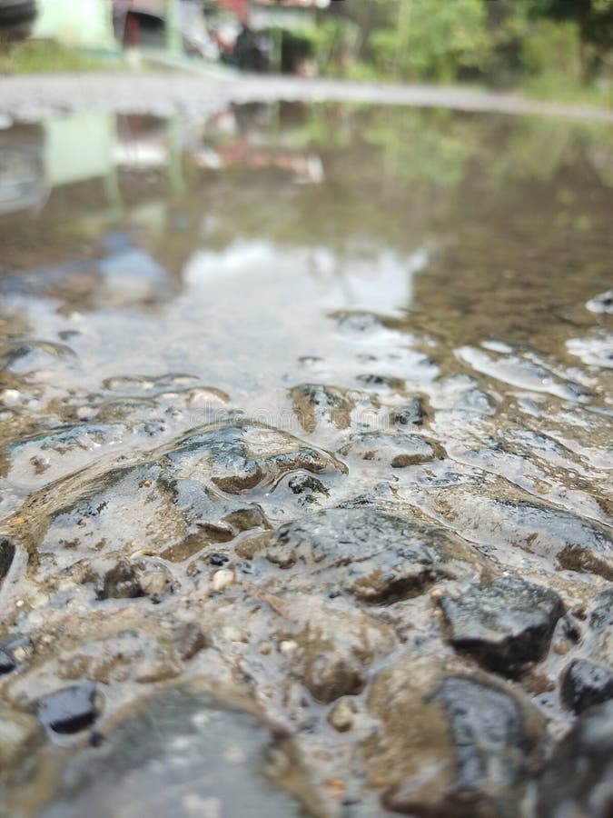 Puddle water stone stock image. Image of stone, stream - 219176743