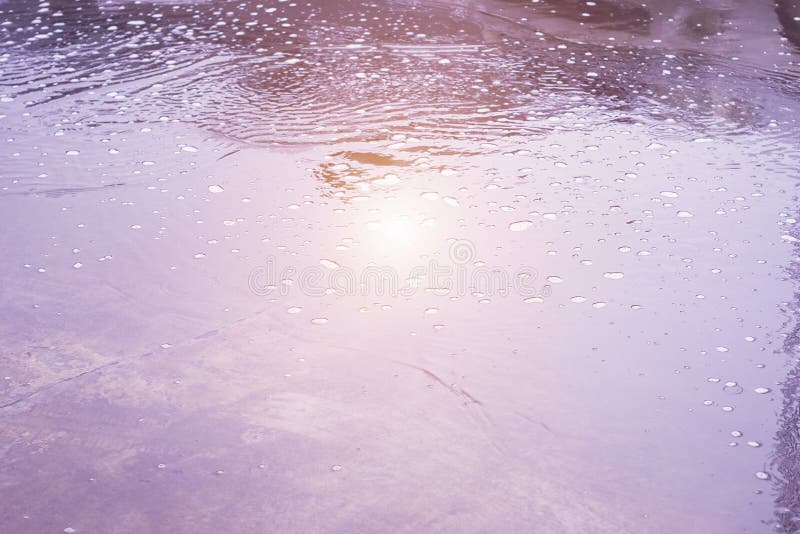 Puddles on the Cement Floor There are Bubbles and Reflections of the ...