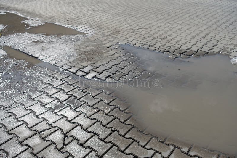 Puddles of Rain and Mud Accumulating on City Streets Stock Image ...