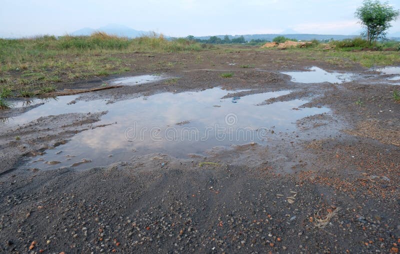 Puddles on the Road, Puddles after the Rain Stock Image - Image of ...