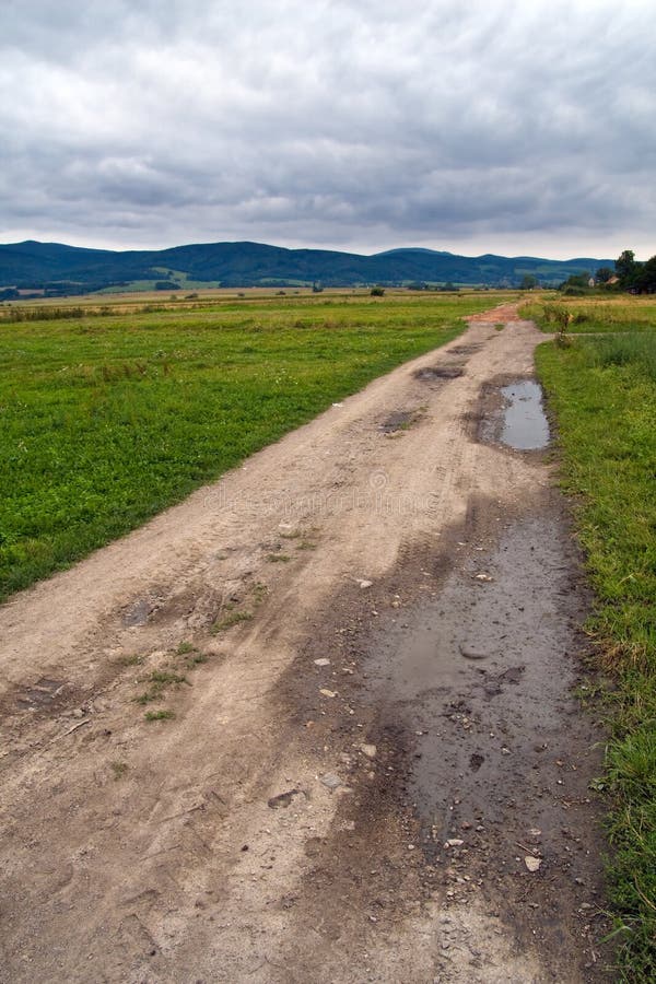 Puddles on a rural road stock photo. Image of water, standing - 25812192
