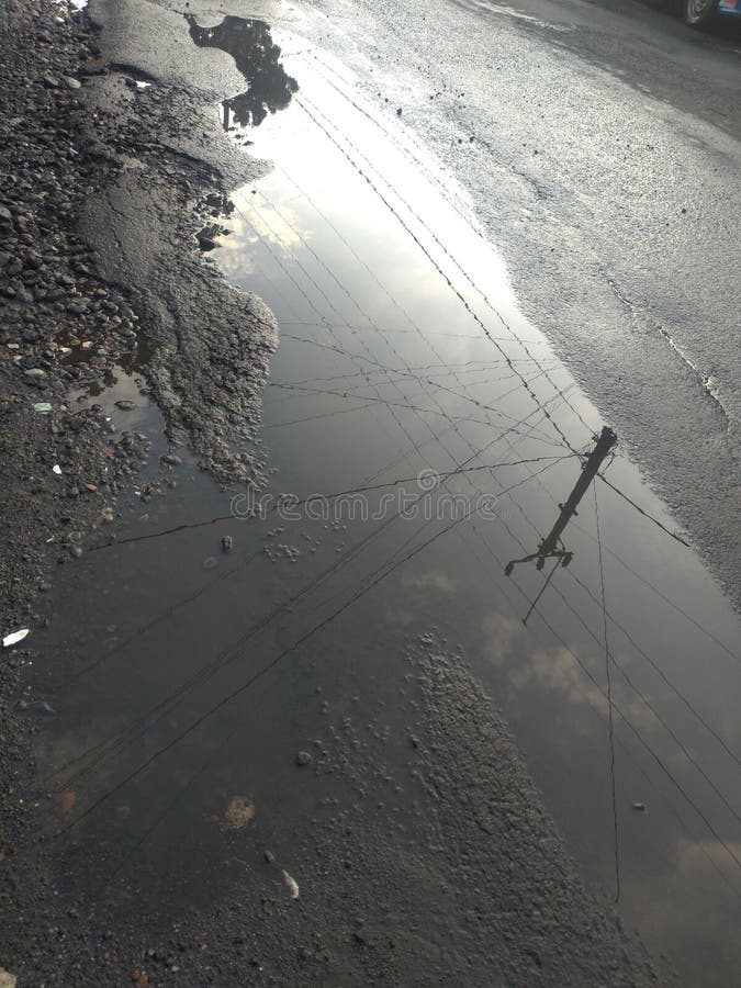 Puddles of Water in the Morning and Reflected Shadows from Surrounding ...