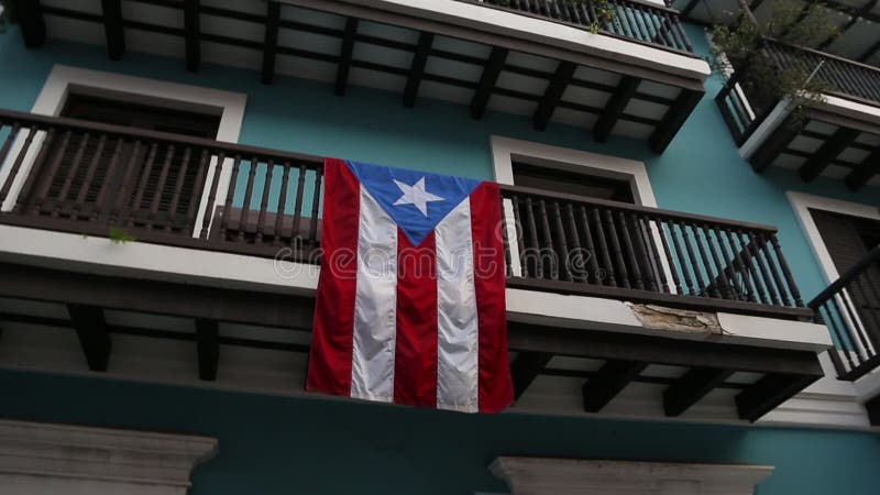 Puerto Rico Flag Hanging on Balcony Tracking Around Stock Footage ...