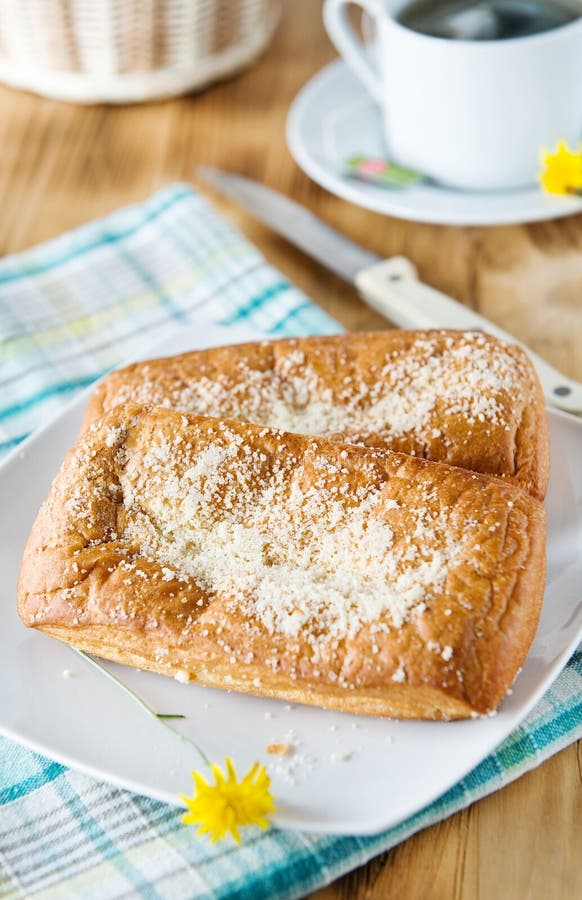 Puff bun and cup of tea stock image. Image of meal, drink - 25721851