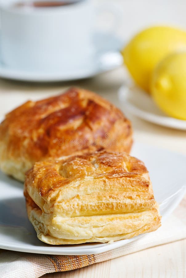 Puff buns, lemons and tea stock image. Image of drink - 25305107