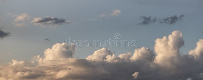 Puff Clouds in the Sky during Sunset. Zoom in Stock Image - Image of ...