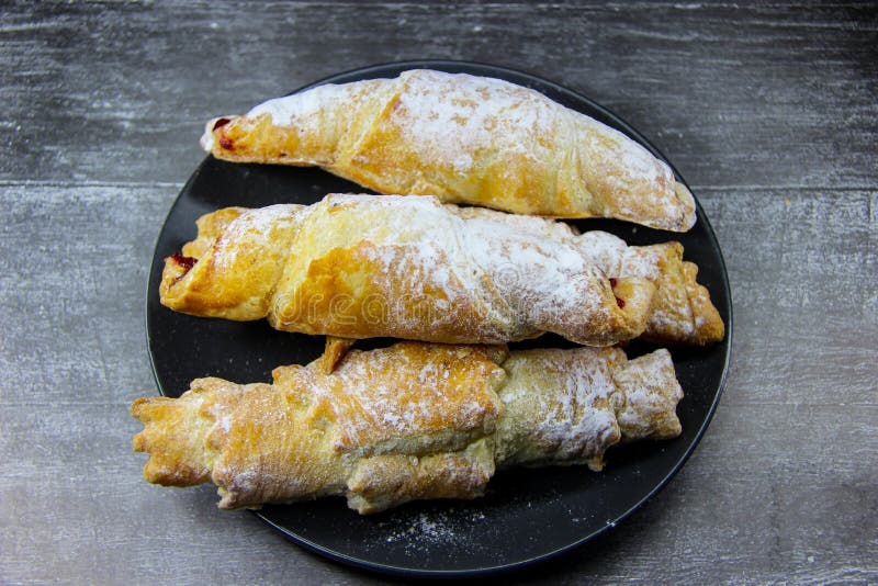 Puff Pastry Buns on a Black Plate. View from Above Stock Photo - Image ...