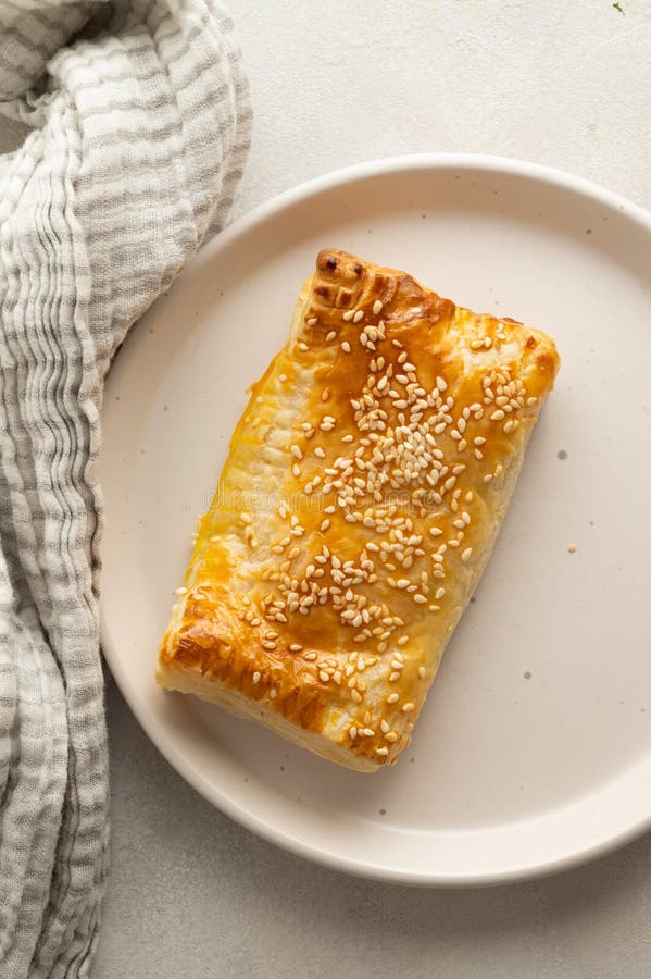 Puff Pastry Dough. Folded Baked Puff Pastry Pie in a Plate. Stock Photo ...
