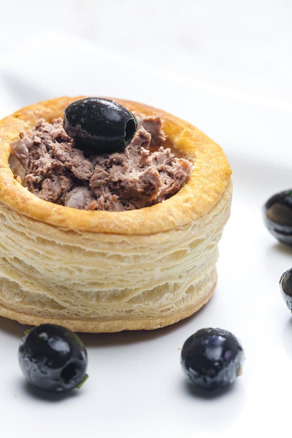 Puff Pastry Filled with Terrine Served with Black Olives Stock Photo ...