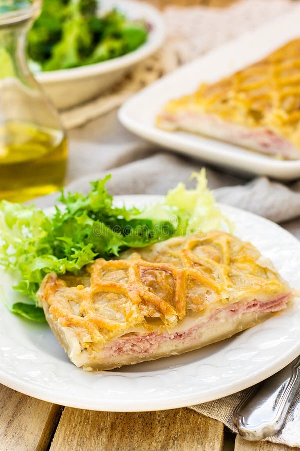 Puff Pastry Pasty with Bechamel Sauce, Ham and Cheese Stock Photo ...