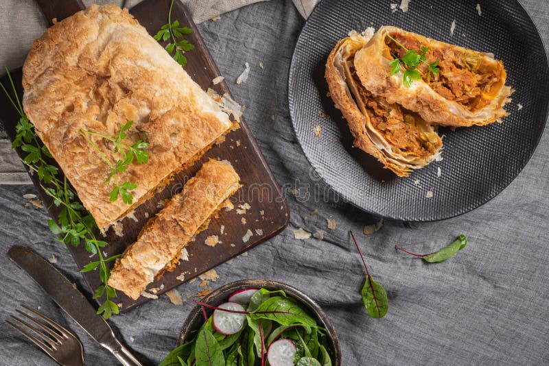 Puff Pastry Vegetable Roll on Kitchen Table with Christmas Decorated ...