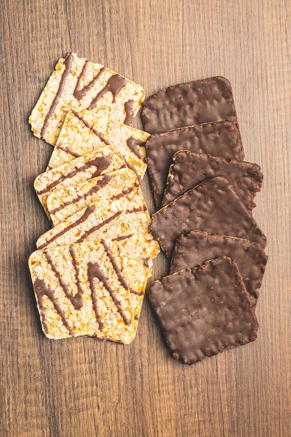 Puffed Corn Crackers Chocolate Covered on Wooden Table Stock Photo ...
