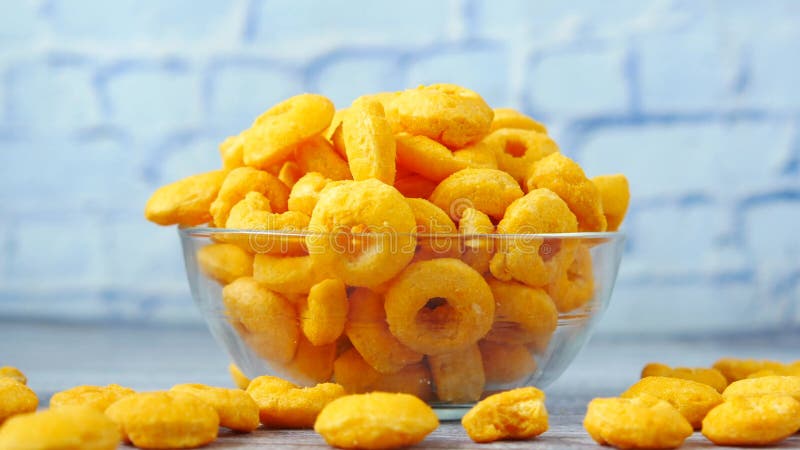 Puffed Corn Rings Chips in Black Bowl on White Background Stock Video ...