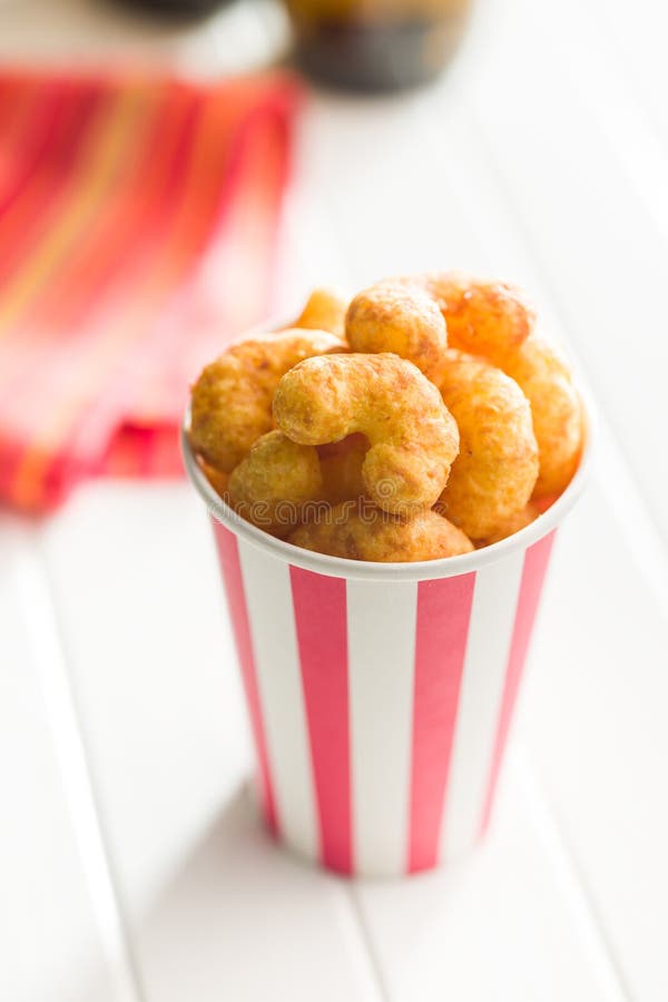 Puffed Crispy Peanut Flips in Cup on White Table Stock Image - Image of ...