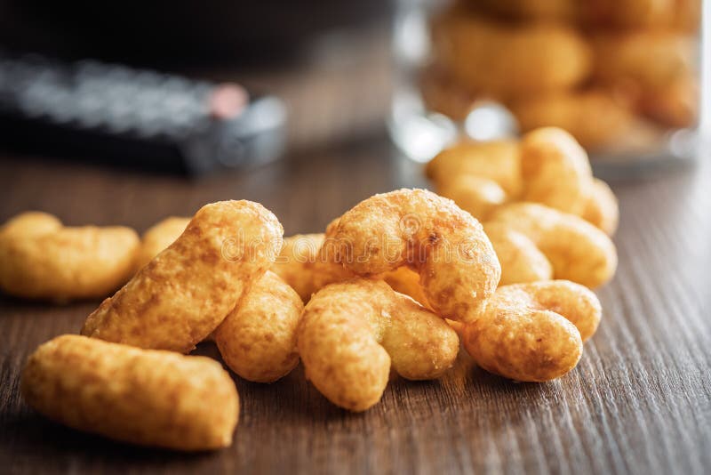 Puffed Crispy Peanut Flips on Wooden Table Stock Image - Image of ...