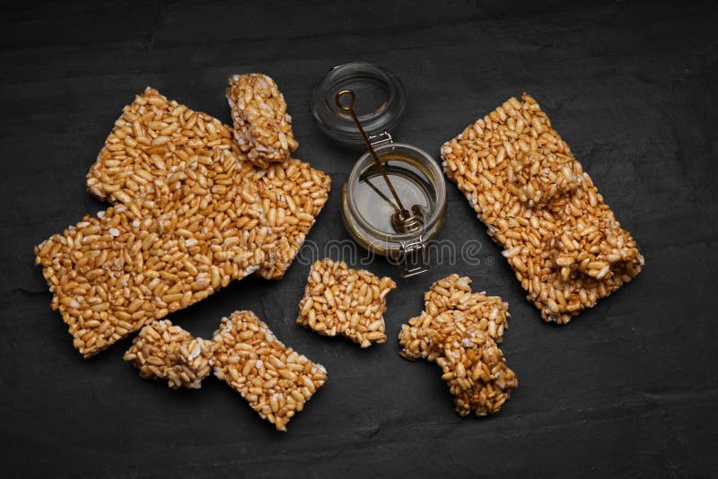 Puffed Rice Bars (kozinaki) on Black Table, Flat Lay Stock Photo ...