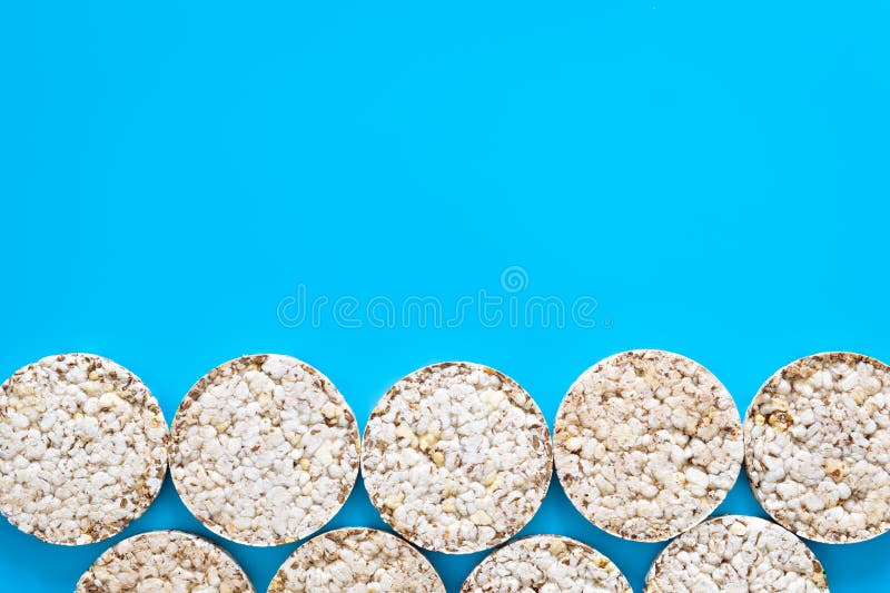 Puffed Rice Cakes on Blue Background, Flat Lay, Copy Space. Stock Photo ...