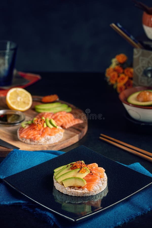 Puffed Rice Spread with Raw Salmon and Avocado Stock Photo - Image of ...