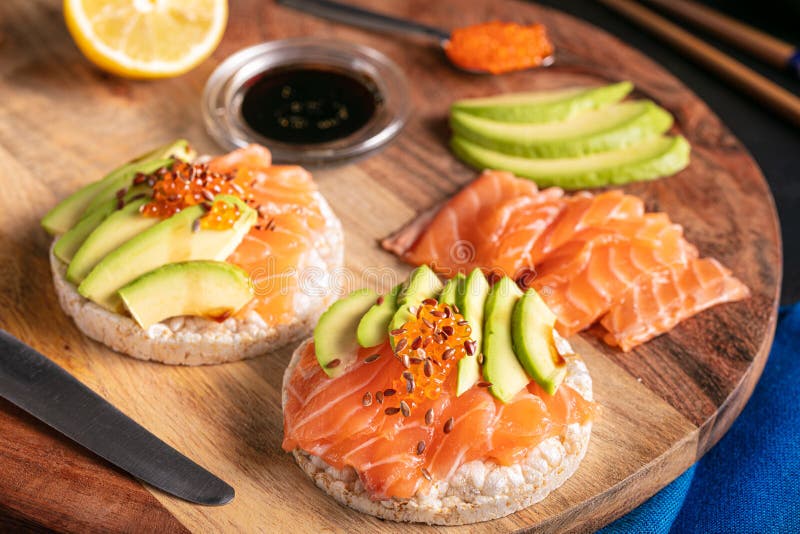Puffed Rice Spread with Raw Salmon and Avocado Stock Photo - Image of ...