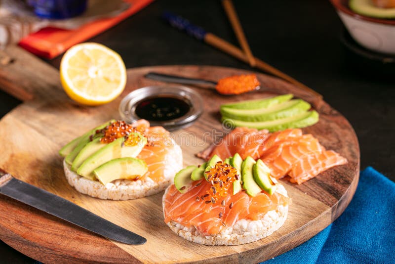 Puffed Rice Spread with Raw Salmon and Avocado Stock Image - Image of ...