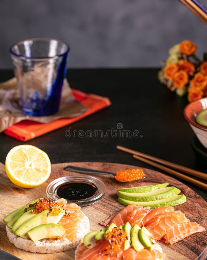 Puffed Rice Spread with Raw Salmon and Avocado Stock Photo - Image of ...