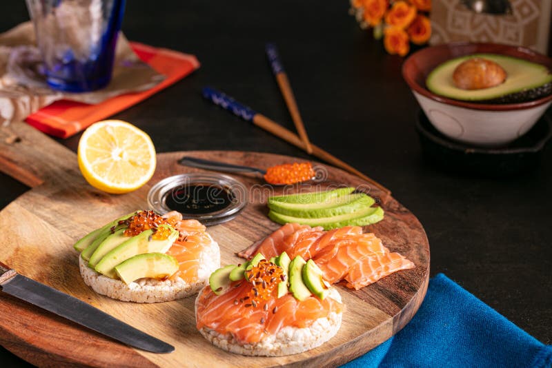 Puffed Rice Spread with Raw Salmon and Avocado Stock Image - Image of ...