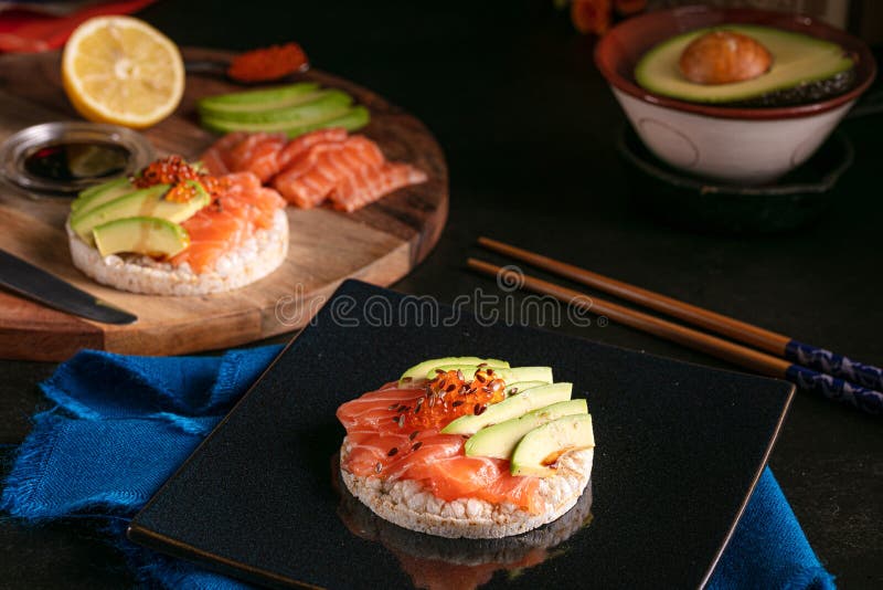 Puffed Rice Spread with Raw Salmon and Avocado Stock Image - Image of ...