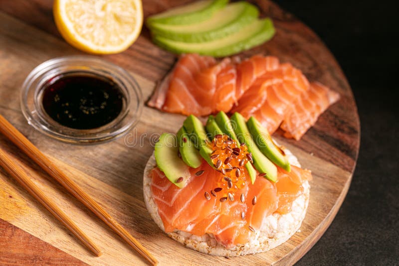 Puffed Rice Spread with Raw Salmon and Avocado Stock Image - Image of ...